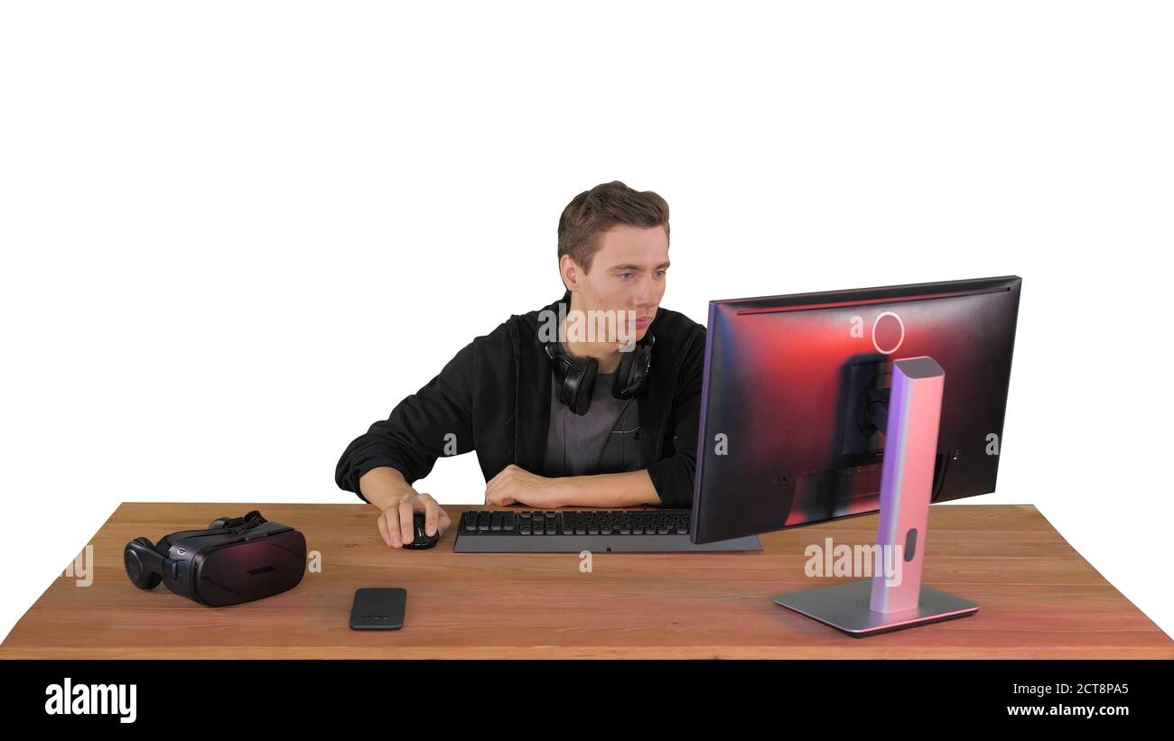 Young man gamer watching stream game on white background Stock Photo ...