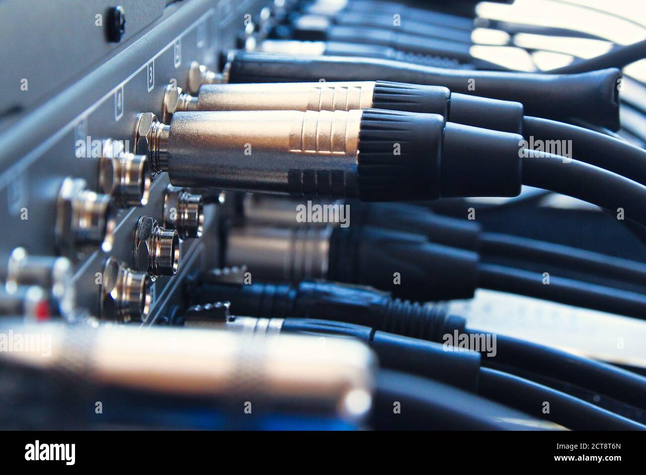 Close up audio jacks cable plugged into mixer console. XLR audio cable ...