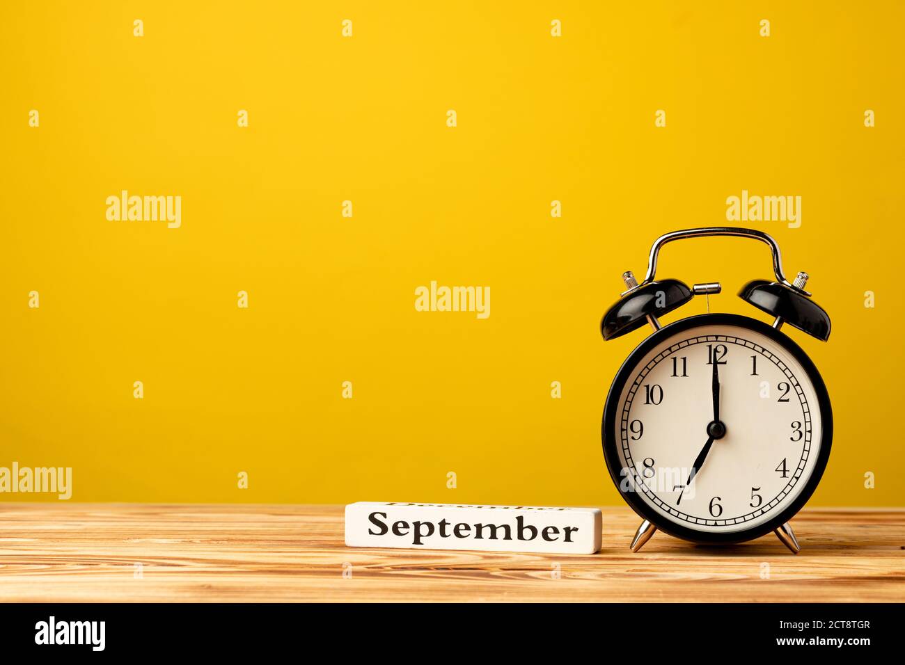 Back to school concept with alarm clock Stock Photo - Alamy