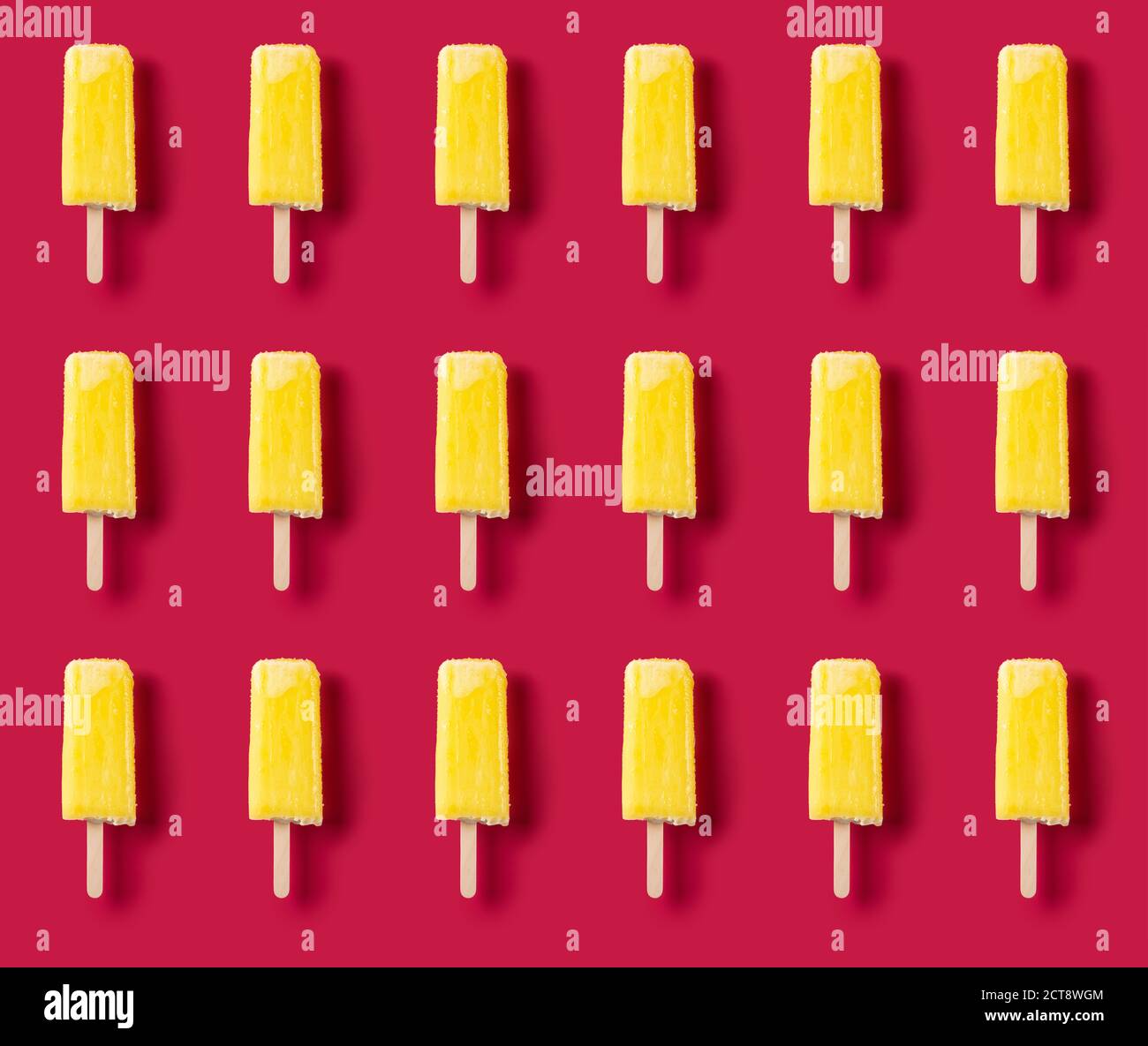 seamless yellow popsicle on a rose red background Stock Photo - Alamy