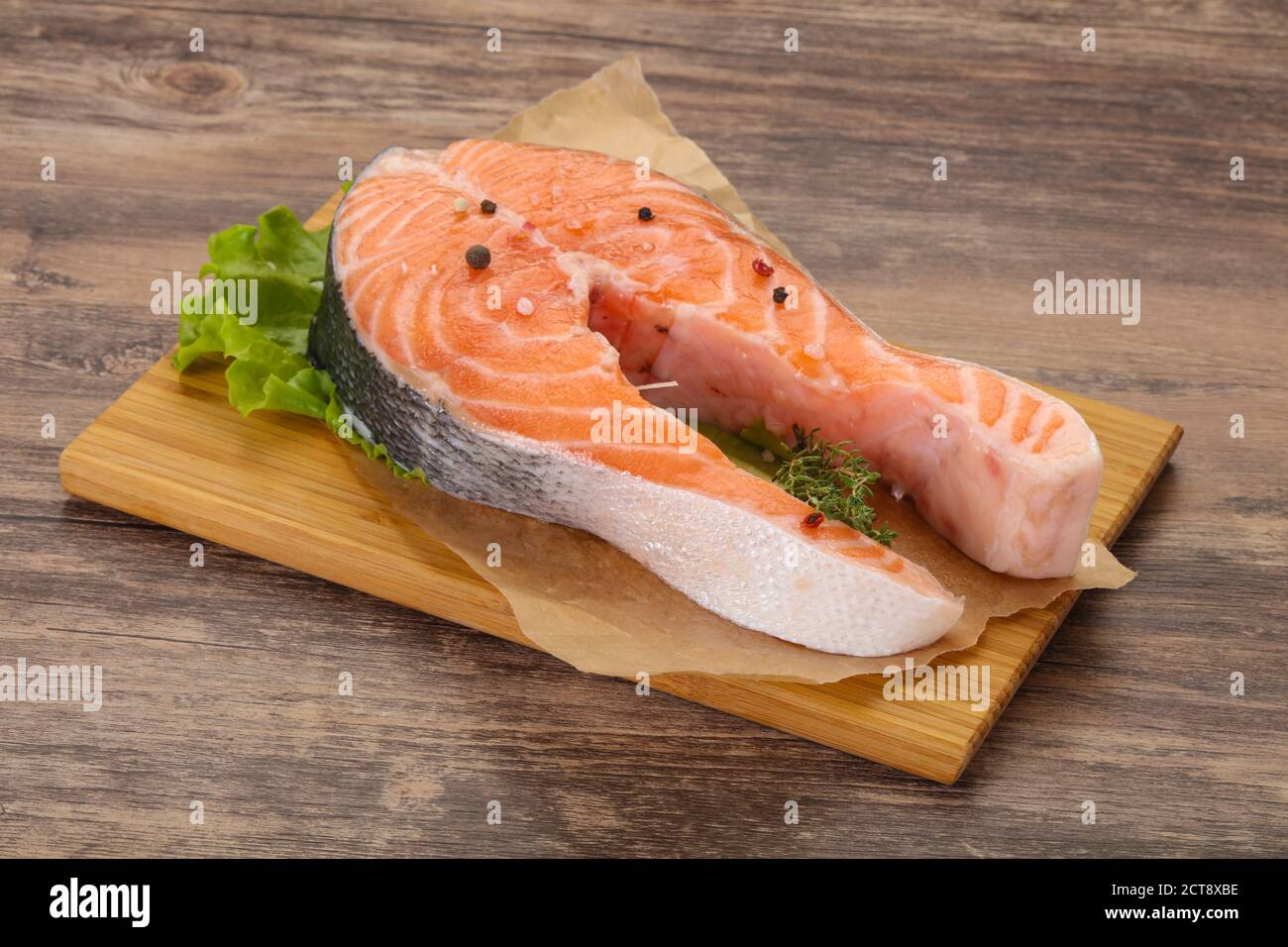 Raw salmon steak with salt and pepper - ready for grill Stock Photo - Alamy
