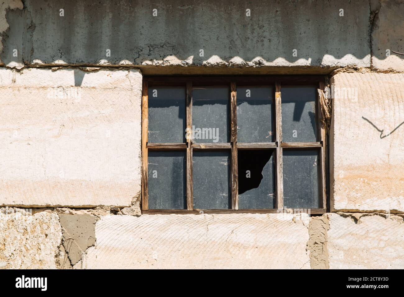 Broken glass in a building window. Housing problems Stock Photo - Alamy