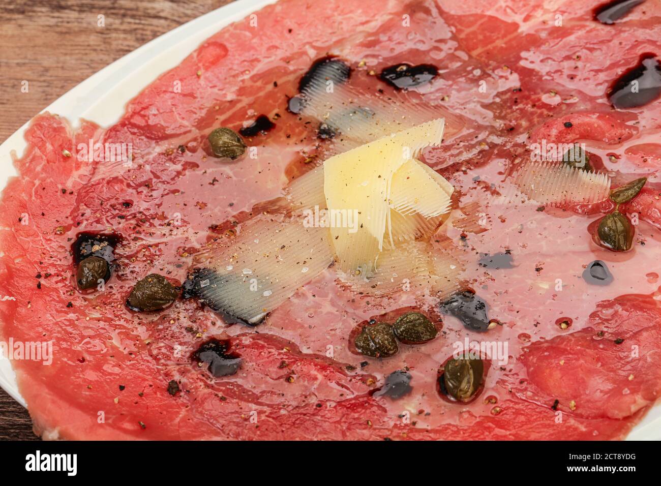 Beef Carpaccio with capers, oil and parmesan Stock Photo - Alamy