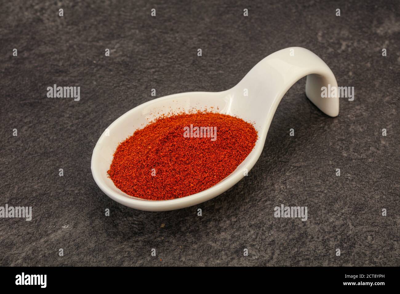 Dry paprika powder in the bowl for cooking Stock Photo - Alamy