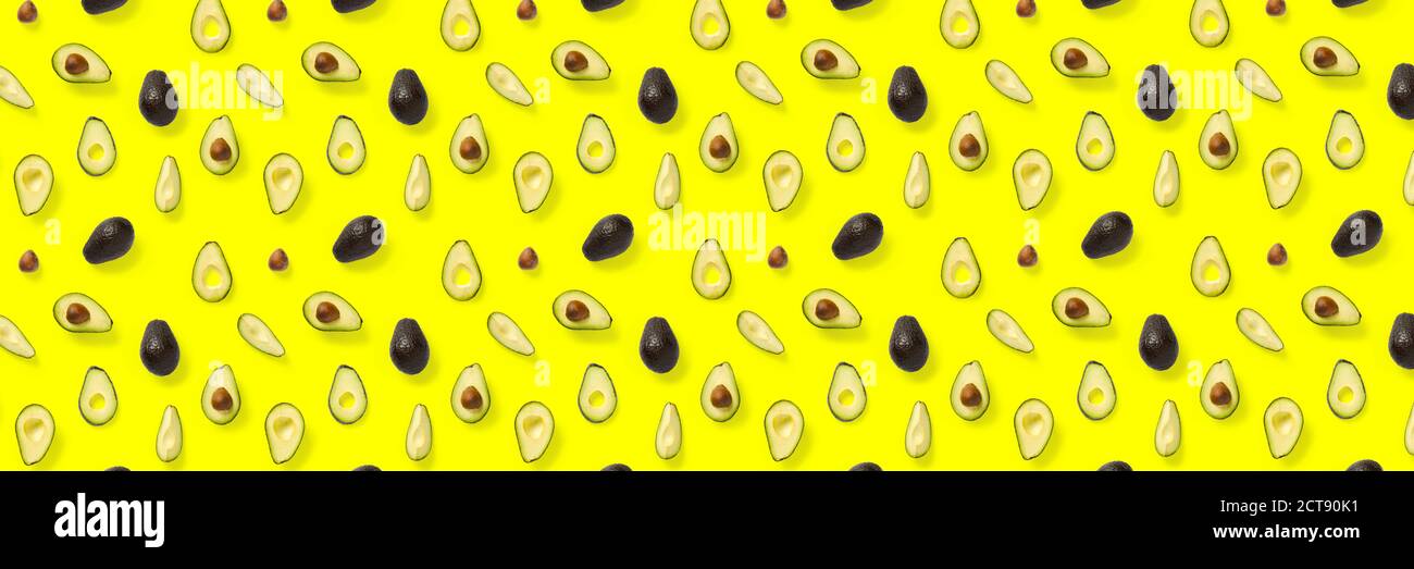Avocado banner. Background made from isolated Avocado pieces on yellow ...