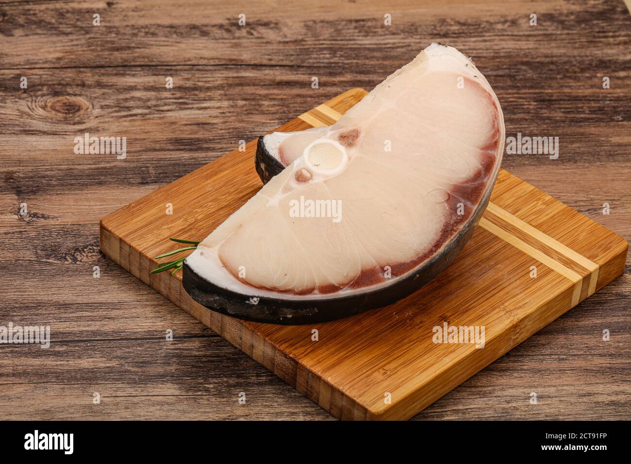 Raw shark steak served rosemary for cooking Stock Photo - Alamy