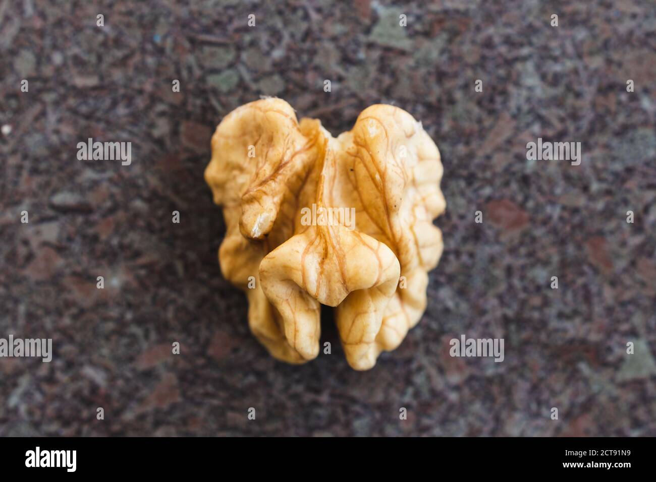 simple food ingredients concept, close-up of walnut kernel on kitchen ...