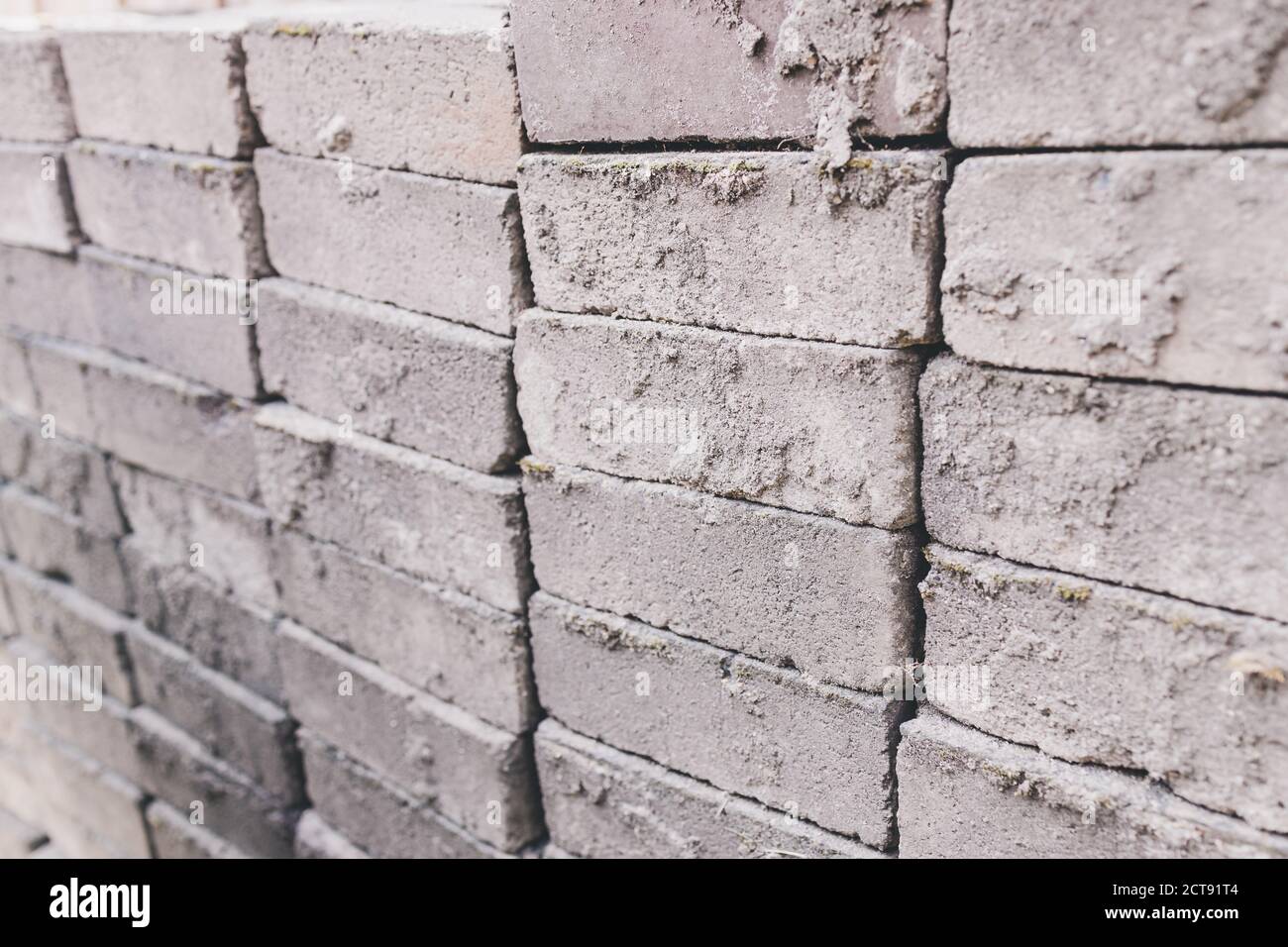 group of outdoor paver bricks stacked up in a wall Stock Photo - Alamy