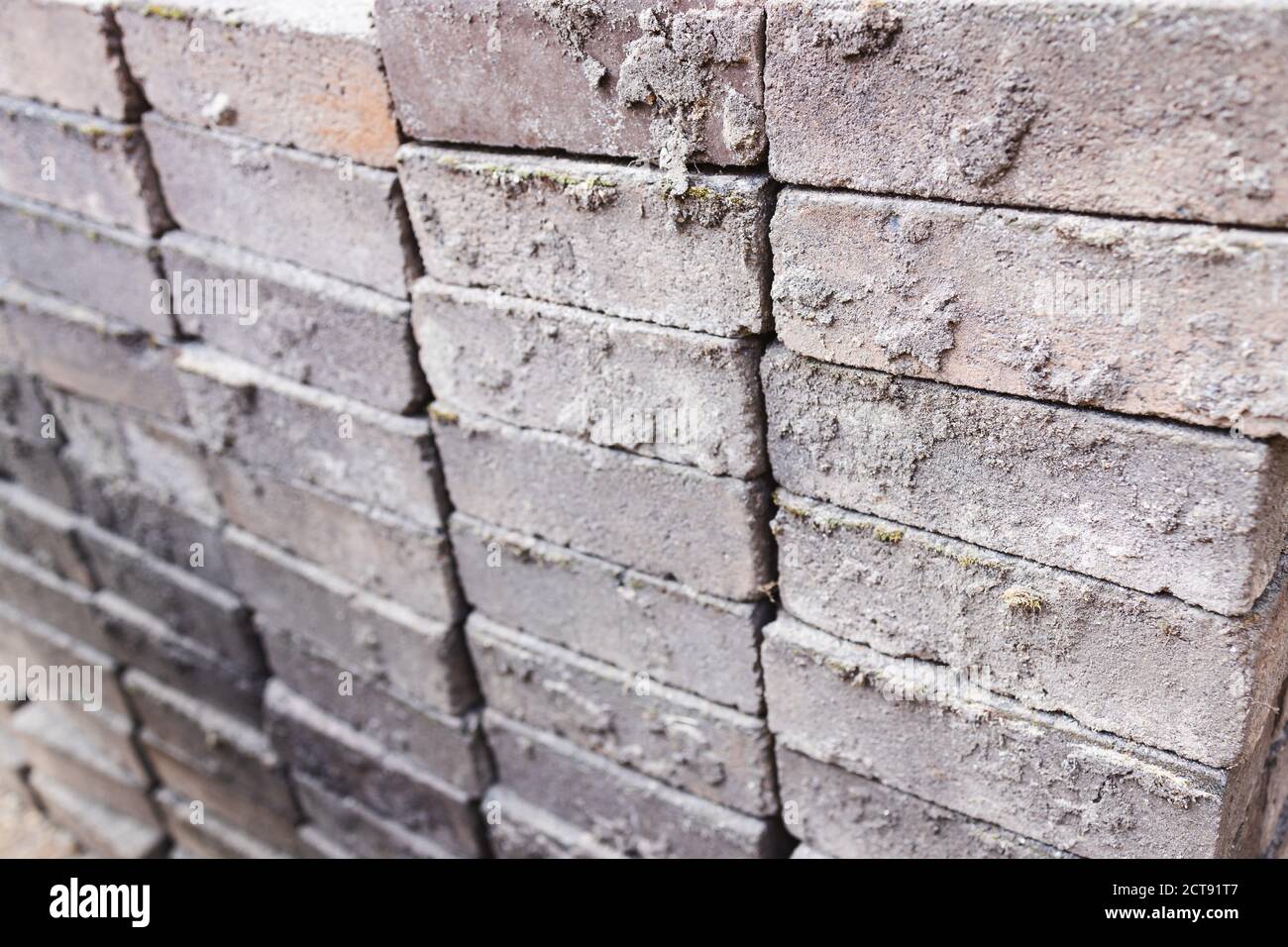 group of outdoor paver bricks stacked up in a wall Stock Photo - Alamy