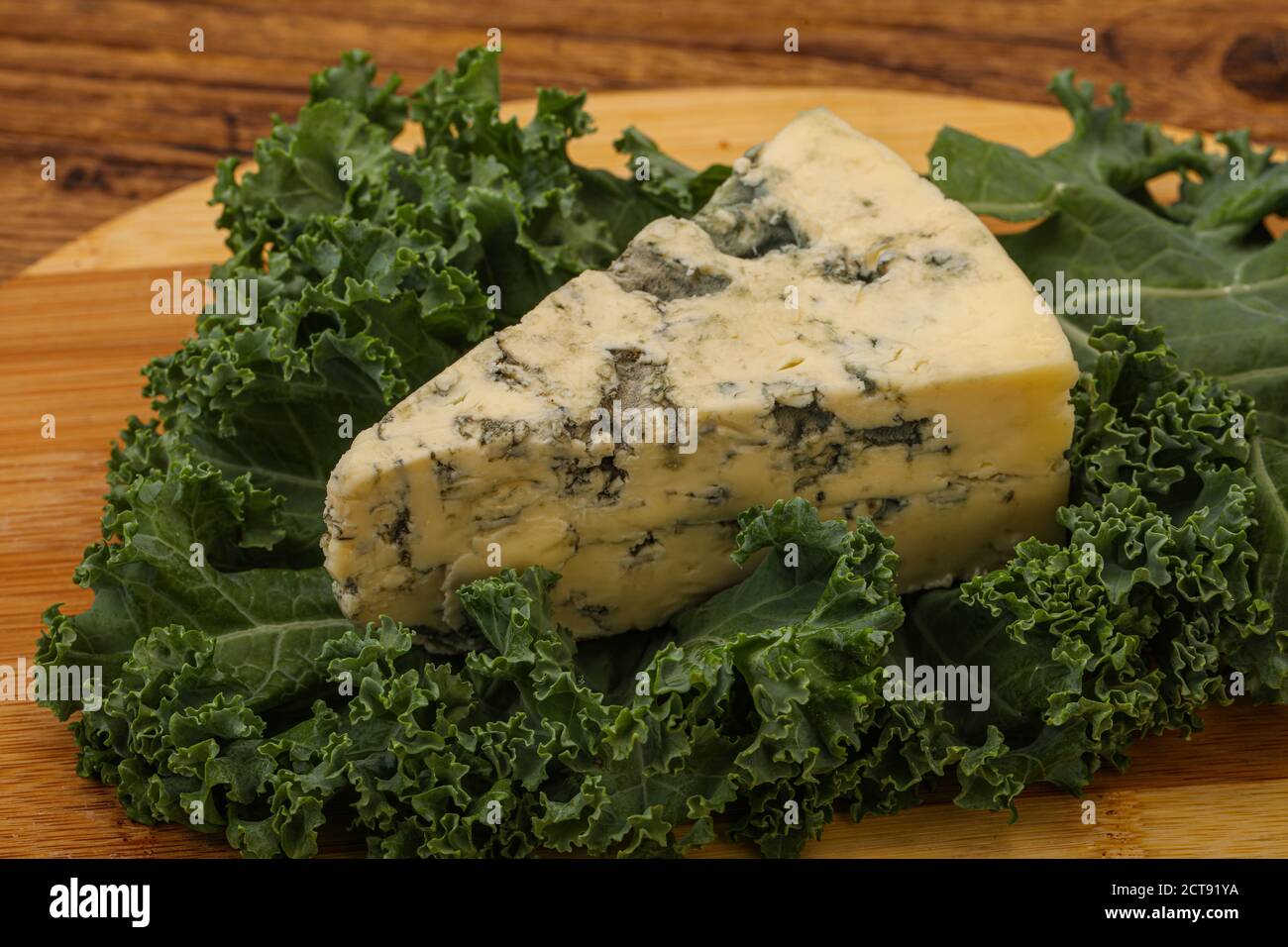 Dairy Blue cheese triangle with mold Stock Photo - Alamy