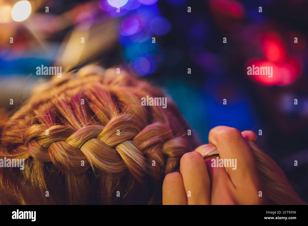 Process of braiding the master weaves braids on her head blond little ...