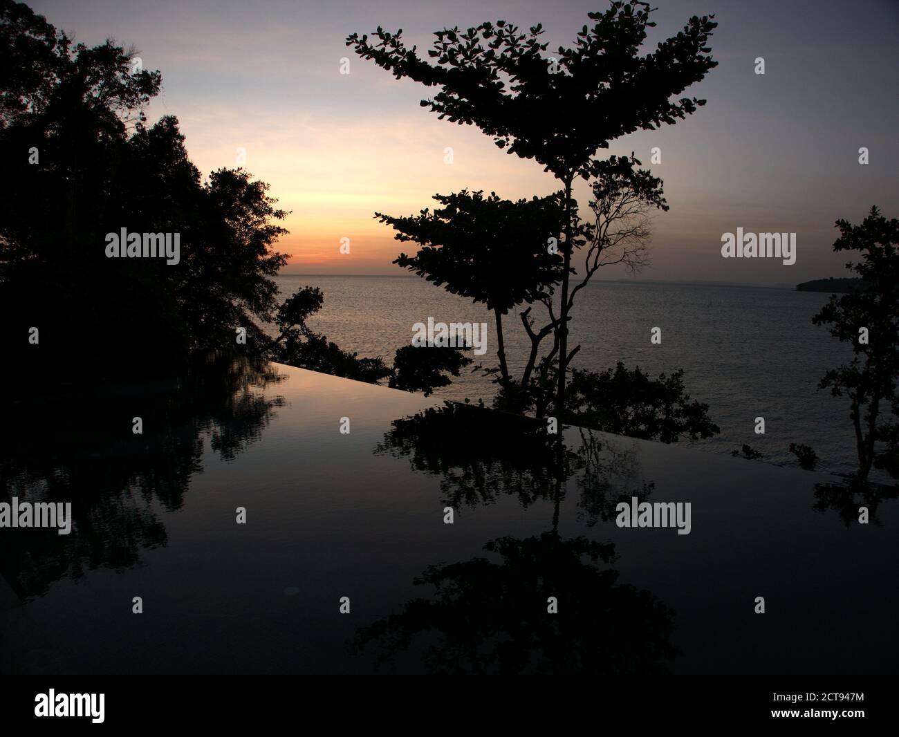 Sunset view over an infinity pool at Six Senses Krabey Island, Cambodia ...