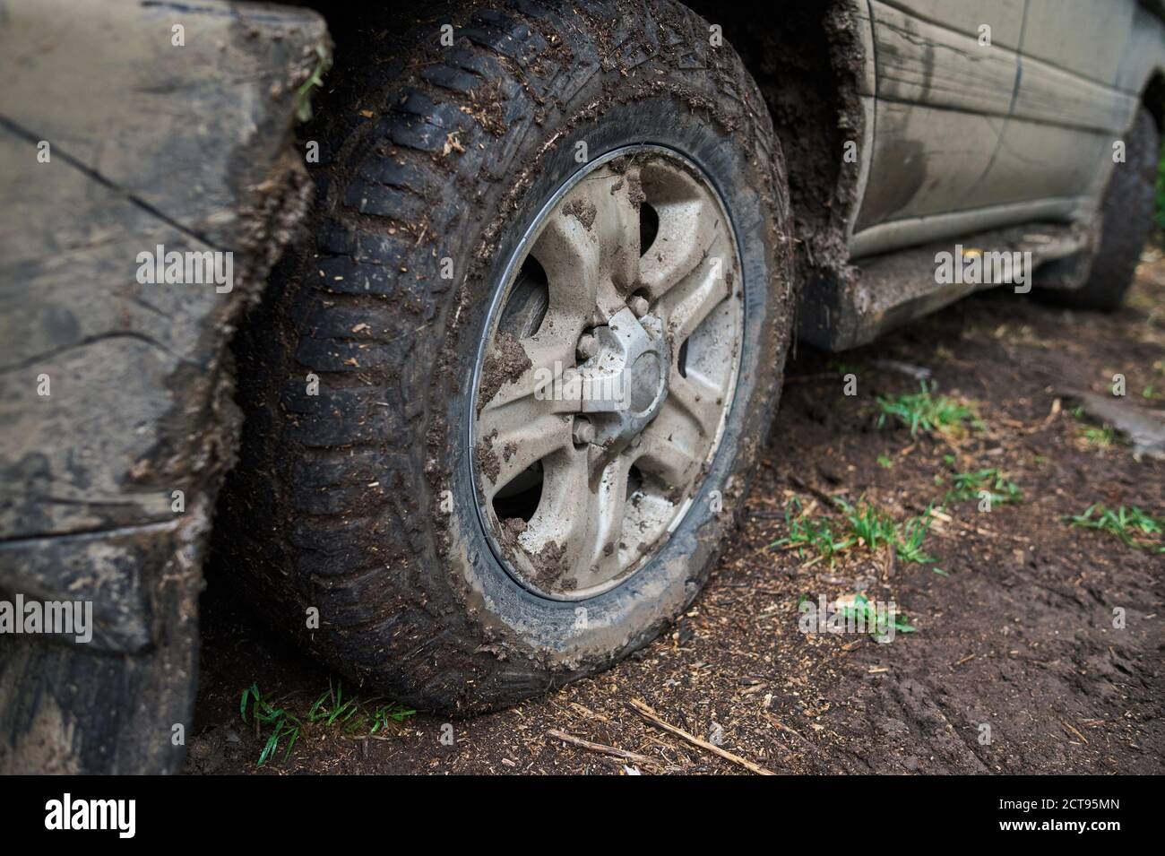 Wheel closeup in a countryside landscape with a muddy road Stock Photo ...