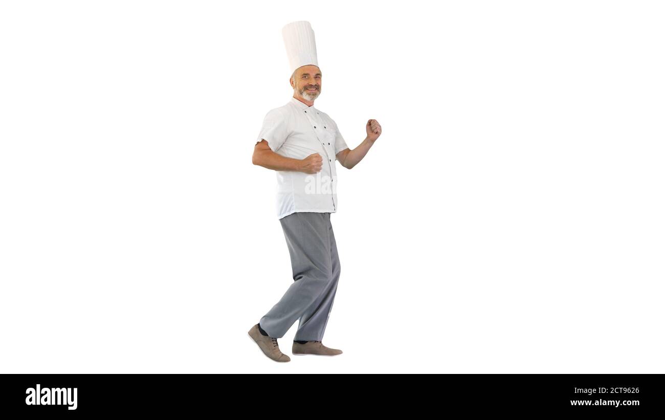 Funny male chef cook dancing on white background Stock Photo - Alamy