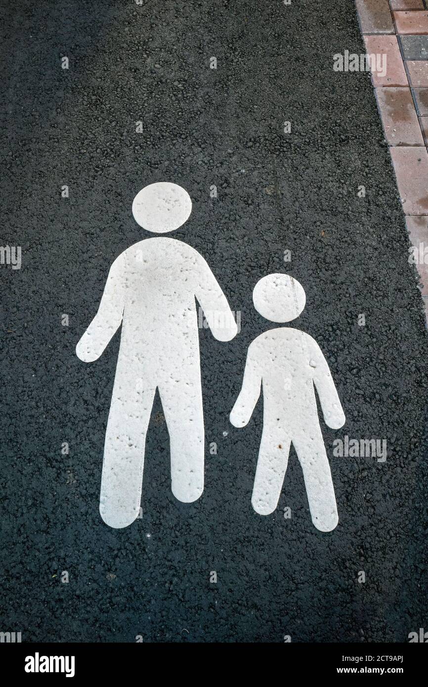 white pedestrian pathway marking on tarmac Stock Photo - Alamy