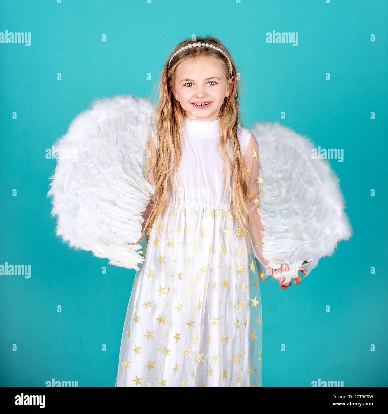 Angel kid with blonde curly hair. Beautiful little angel. Portrait of ...