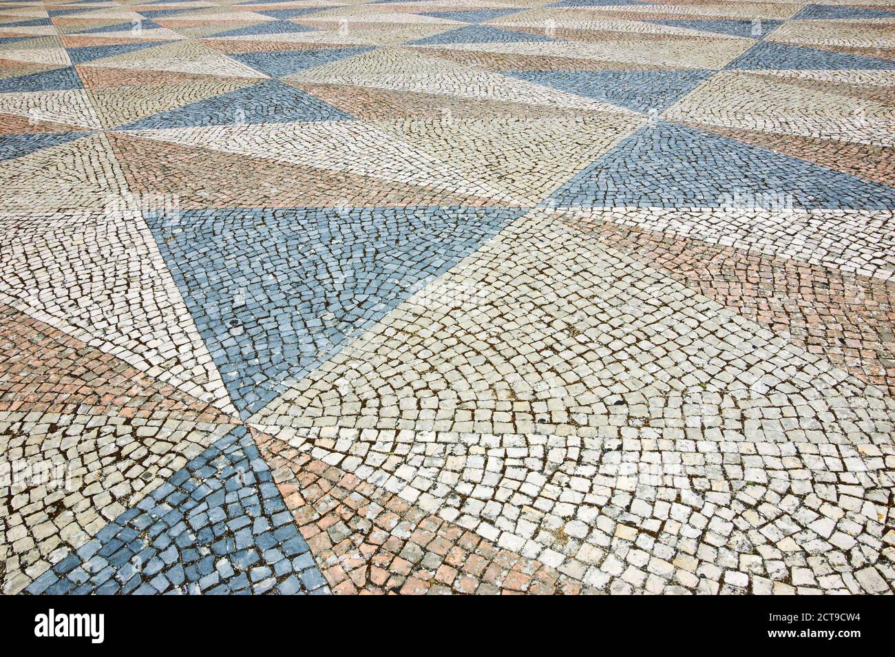 Mosaic tiles pavement background. Triangle paving Stock Photo - Alamy