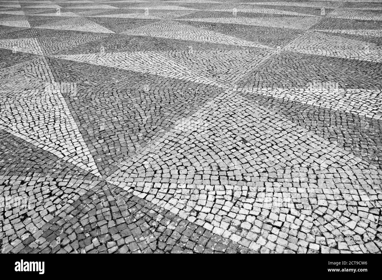 Mosaic tiles pavement background. Triangle paving. Aged photo. Black ...