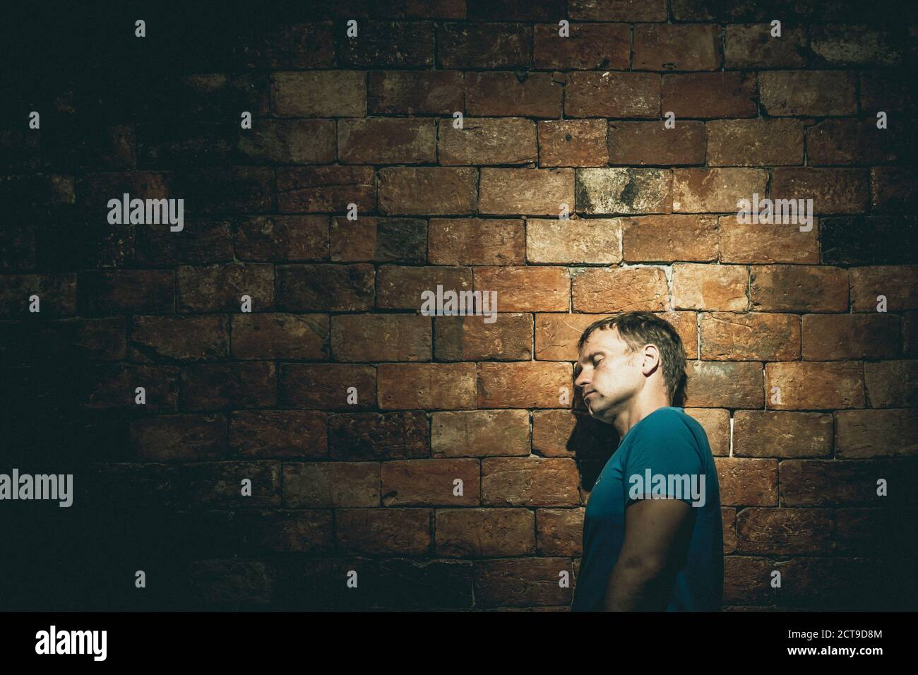 Left side view man under life crisis problems stand wearily leaned head ...