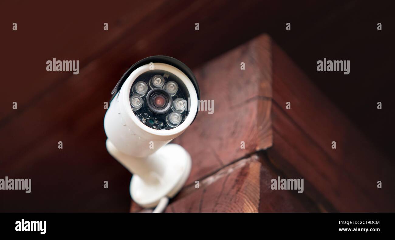 Security CCTV camera in private wooden house building, protection and ...