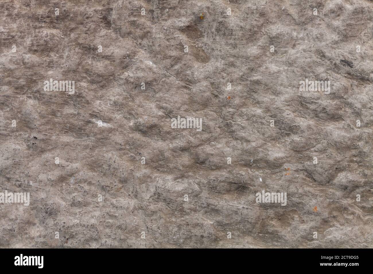 gray jagged stone wall. background for designer Stock Photo - Alamy