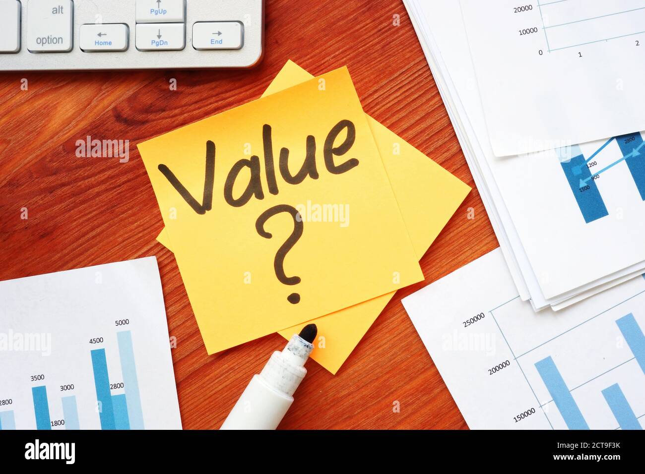 Word value and question mark on a memo stick Stock Photo - Alamy