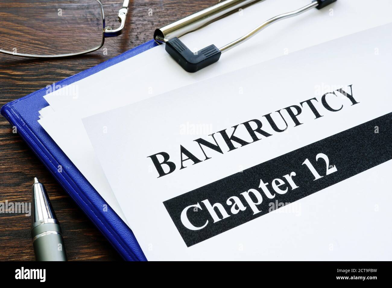 Papers about Bankruptcy chapter 12 and pen on the desk Stock Photo - Alamy