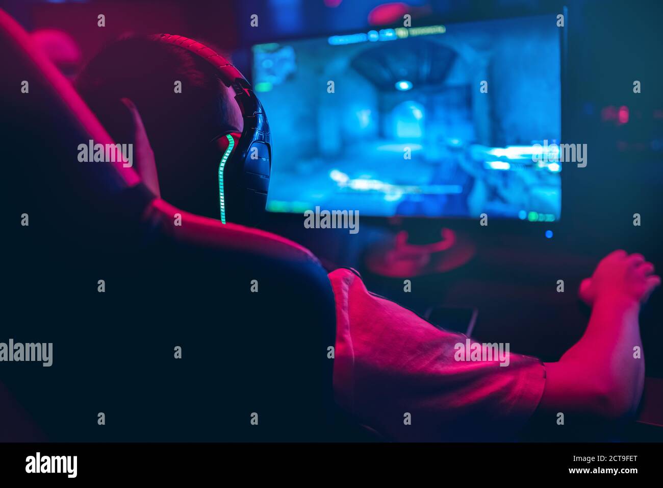 Professional gamer playing online games tournaments pc computer with ...