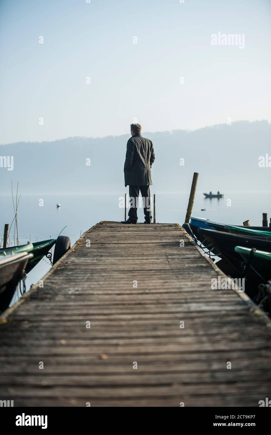 Person standing lake watching hi-res stock photography and images - Alamy