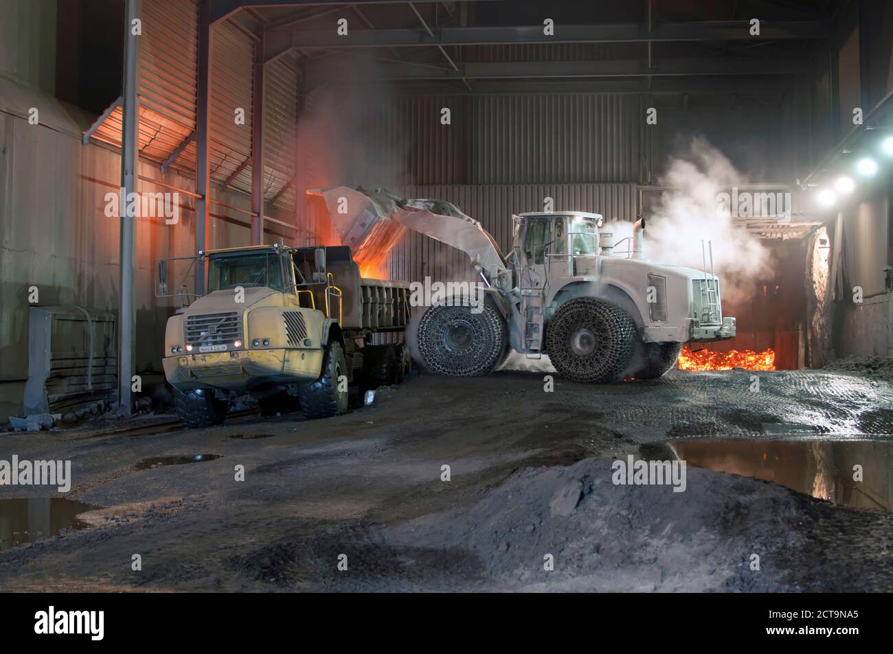 Germany, Steel mill, removal of slag with shovel excavator Stock Photo ...