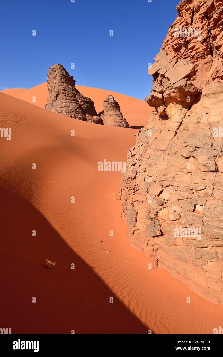 Rock towers in the sand dunes of tin merzouga hi-res stock photography ...