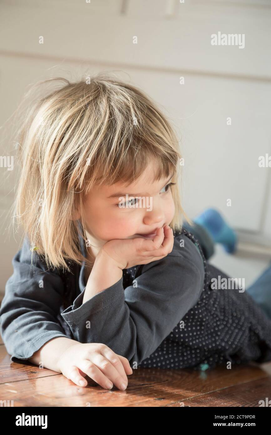 Little girl looking at something Stock Photo - Alamy
