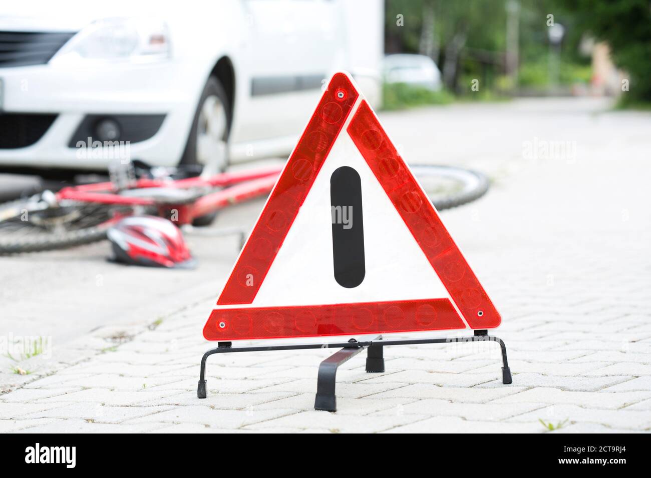 Warning triangle in front of crash scene Stock Photo - Alamy