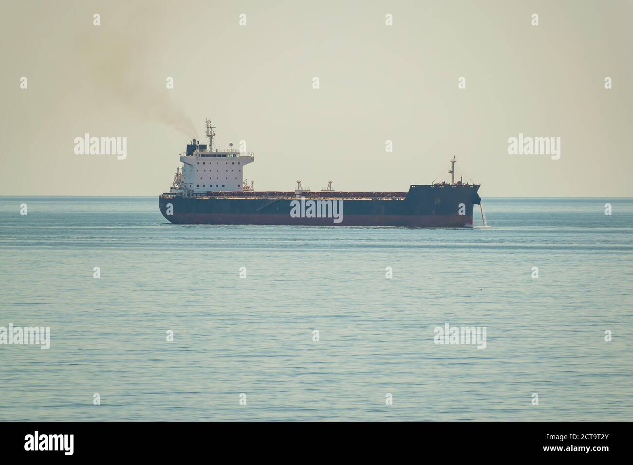 Bulk carrier in calm sea at the daytime Stock Photo - Alamy