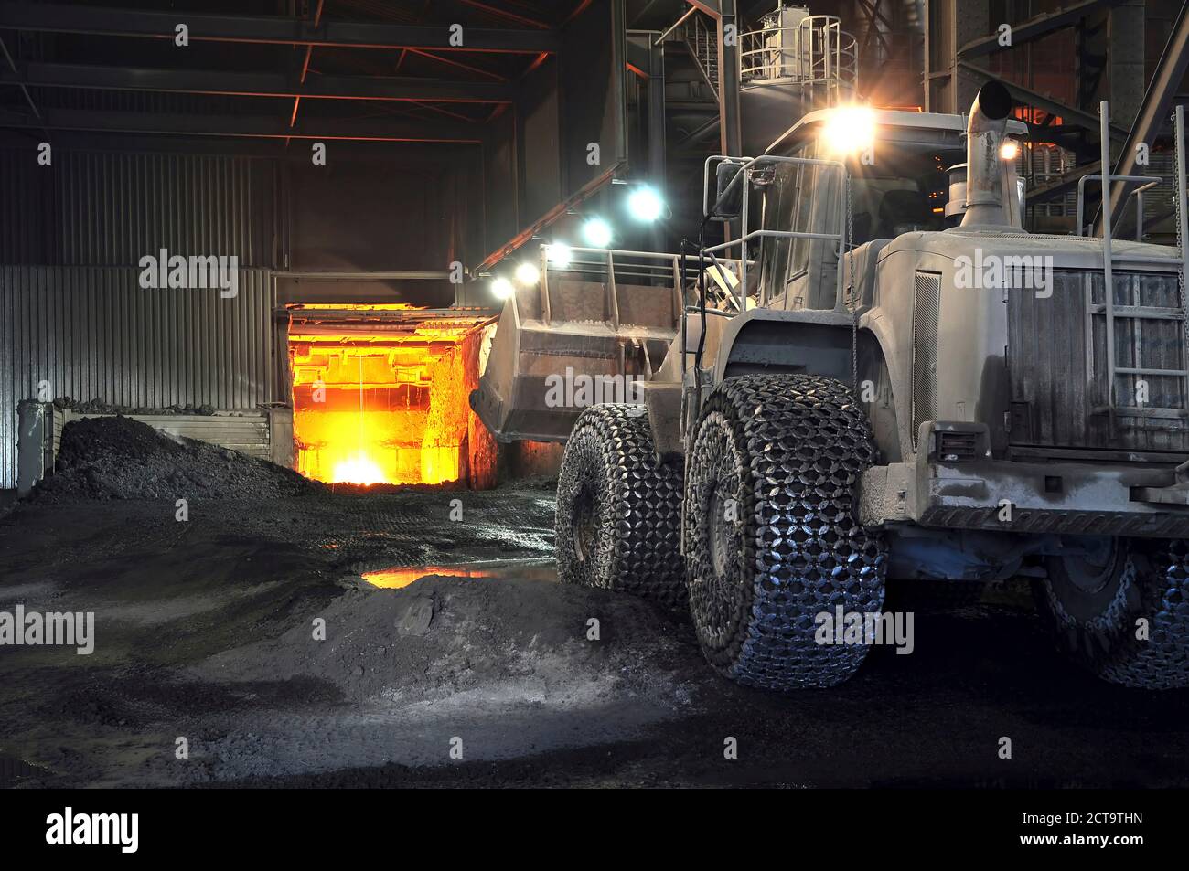 Germany, Steel mill, removal of slag with shovel excavator Stock Photo ...