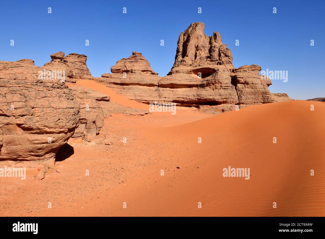 Sandstone rock towers in the sand dunes of tin merzouga hi-res stock ...