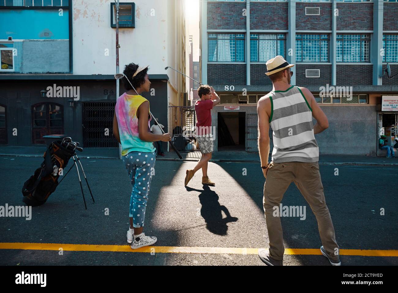 Friends playing urban golf in the city Stock Photo - Alamy