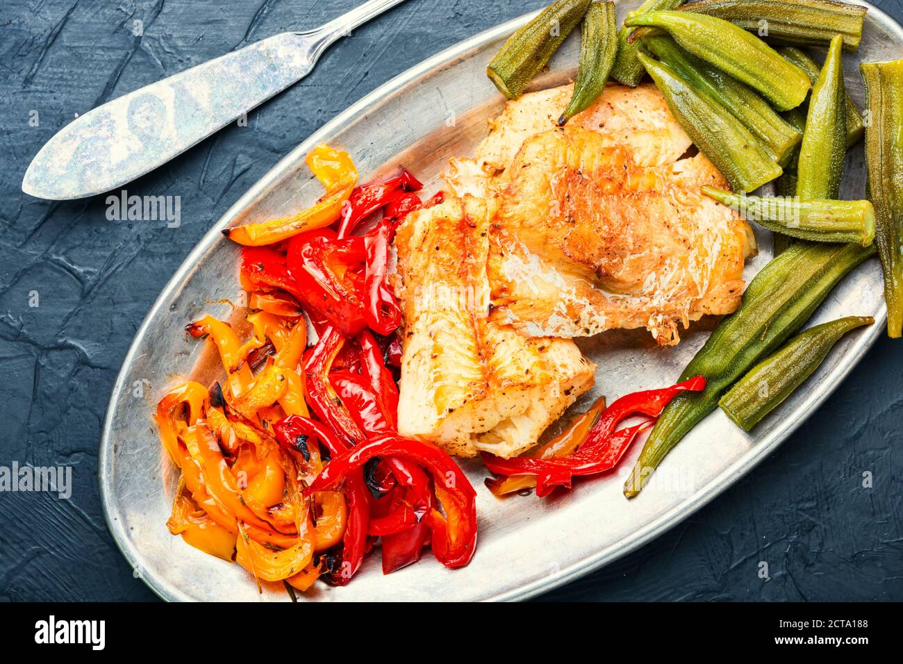 Tray with fish grenadier baked with vegetables.Seafood Stock Photo - Alamy