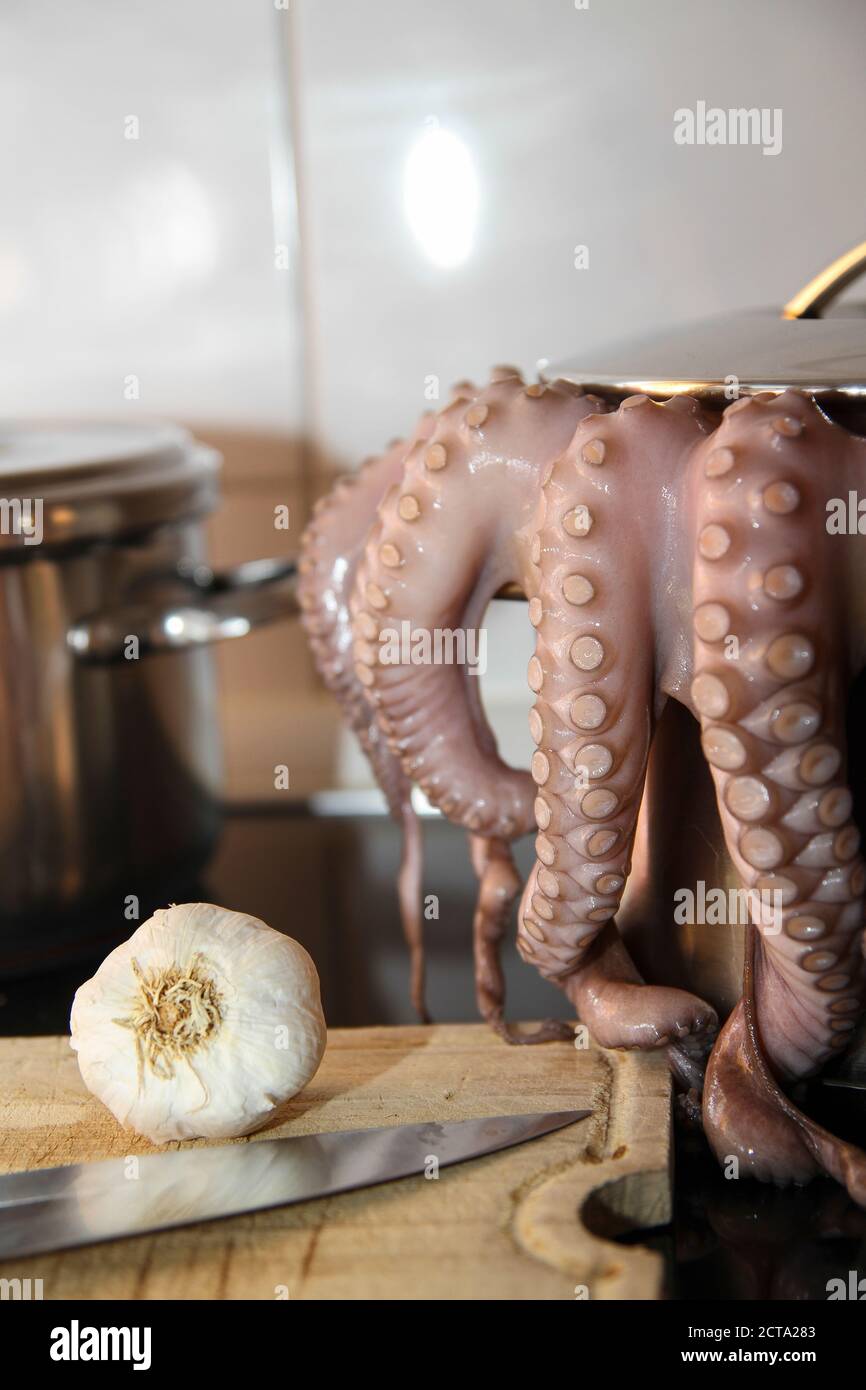 Cooking octopus in vessel Stock Photo - Alamy