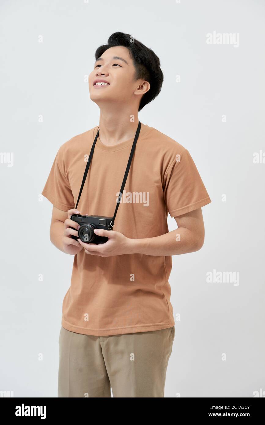 Young Asian man taking photo with his camera when he travelling over ...