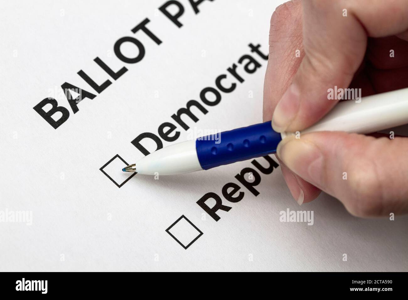 Checklist concept. Voter prepares to vote for Democrat on the ballot ...