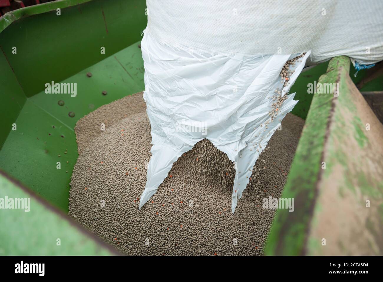 Filling artificial fertilizer into tractor hi-res stock photography and ...