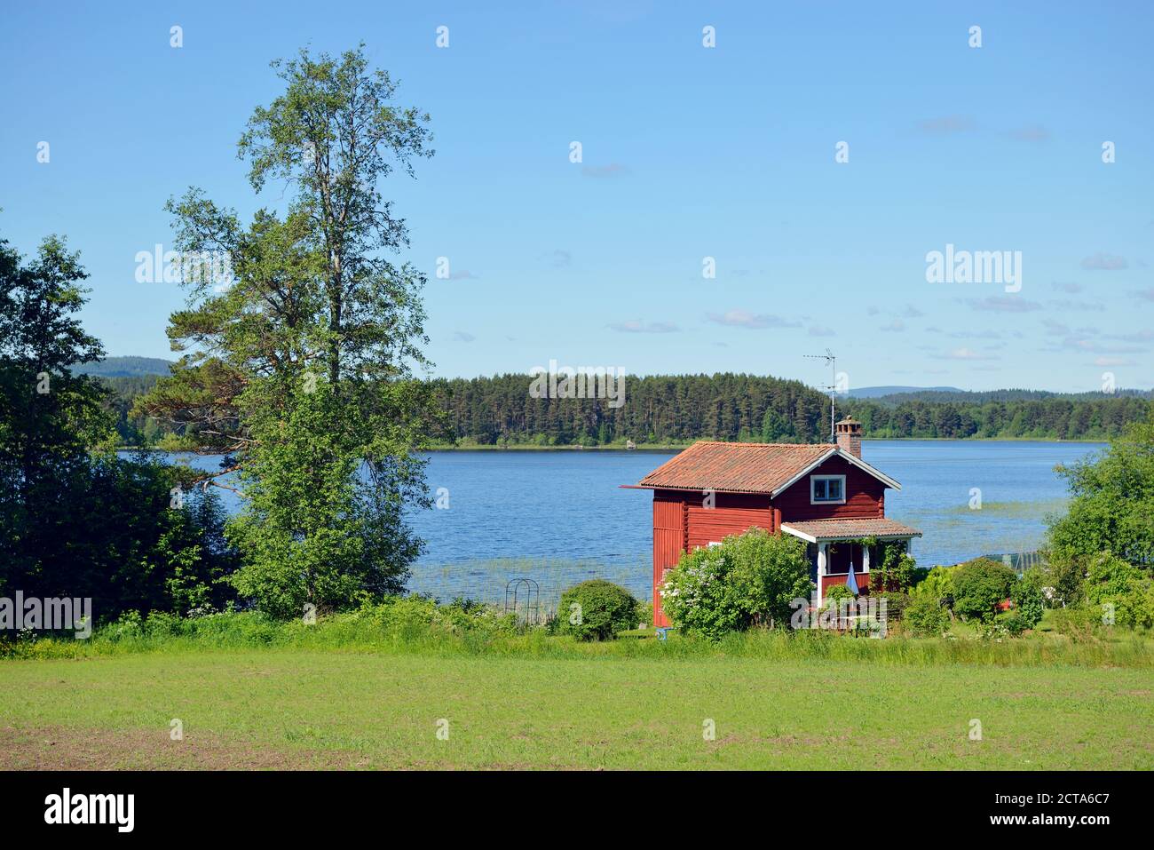 Sweden, Mora, Red hut at Lake Siljan Stock Photo - Alamy