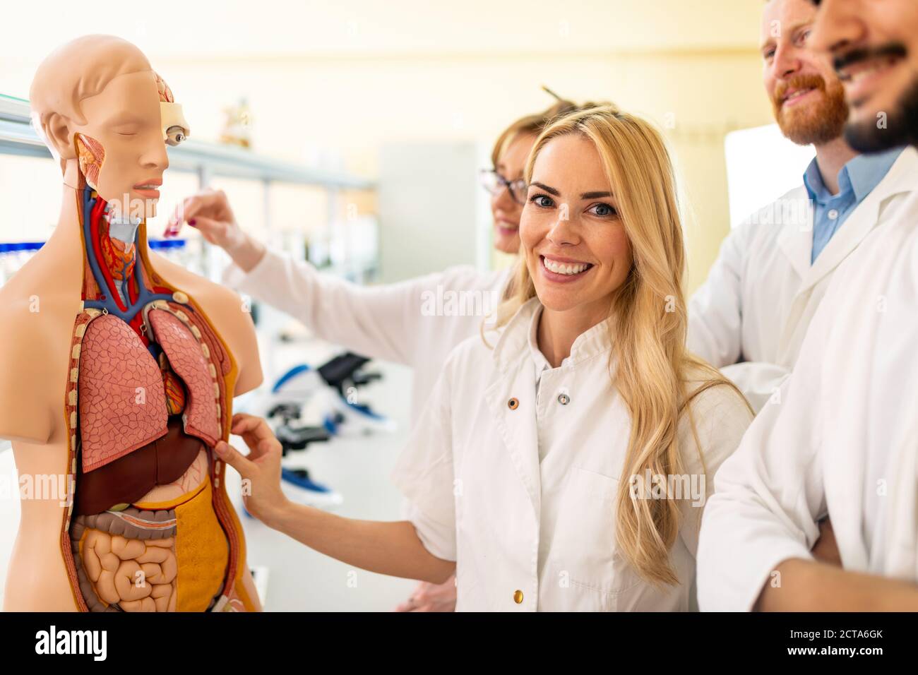 Students of medicine examining anatomical model in classroom Stock ...
