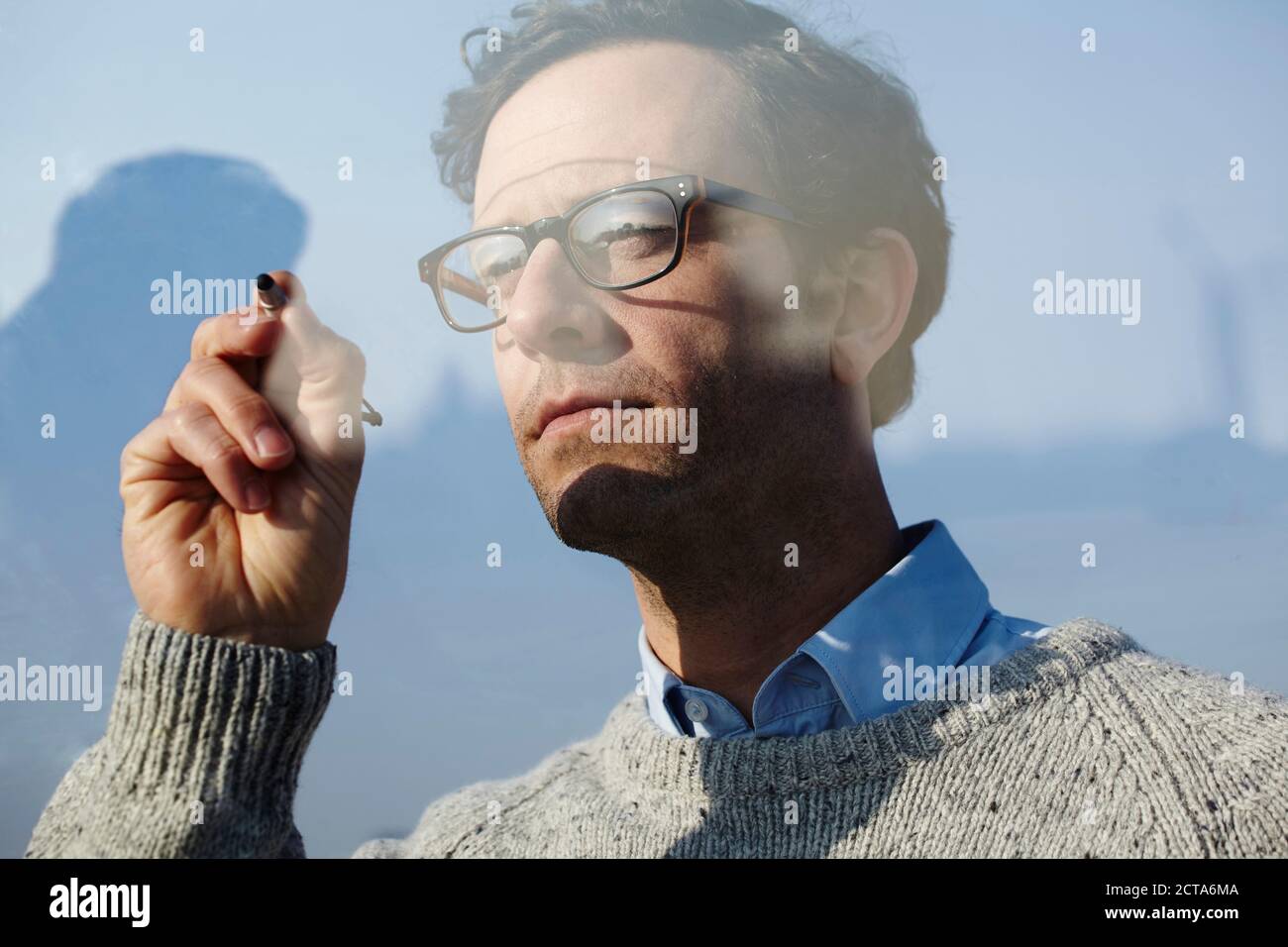 Portrait male person thinking pen hi-res stock photography and images ...
