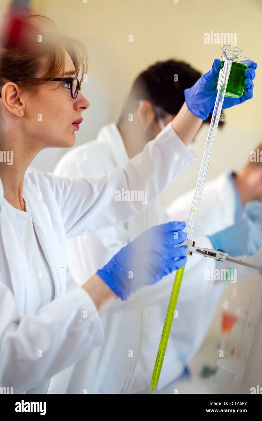 Group of medical scientists working at the laboratory. Research virus ...