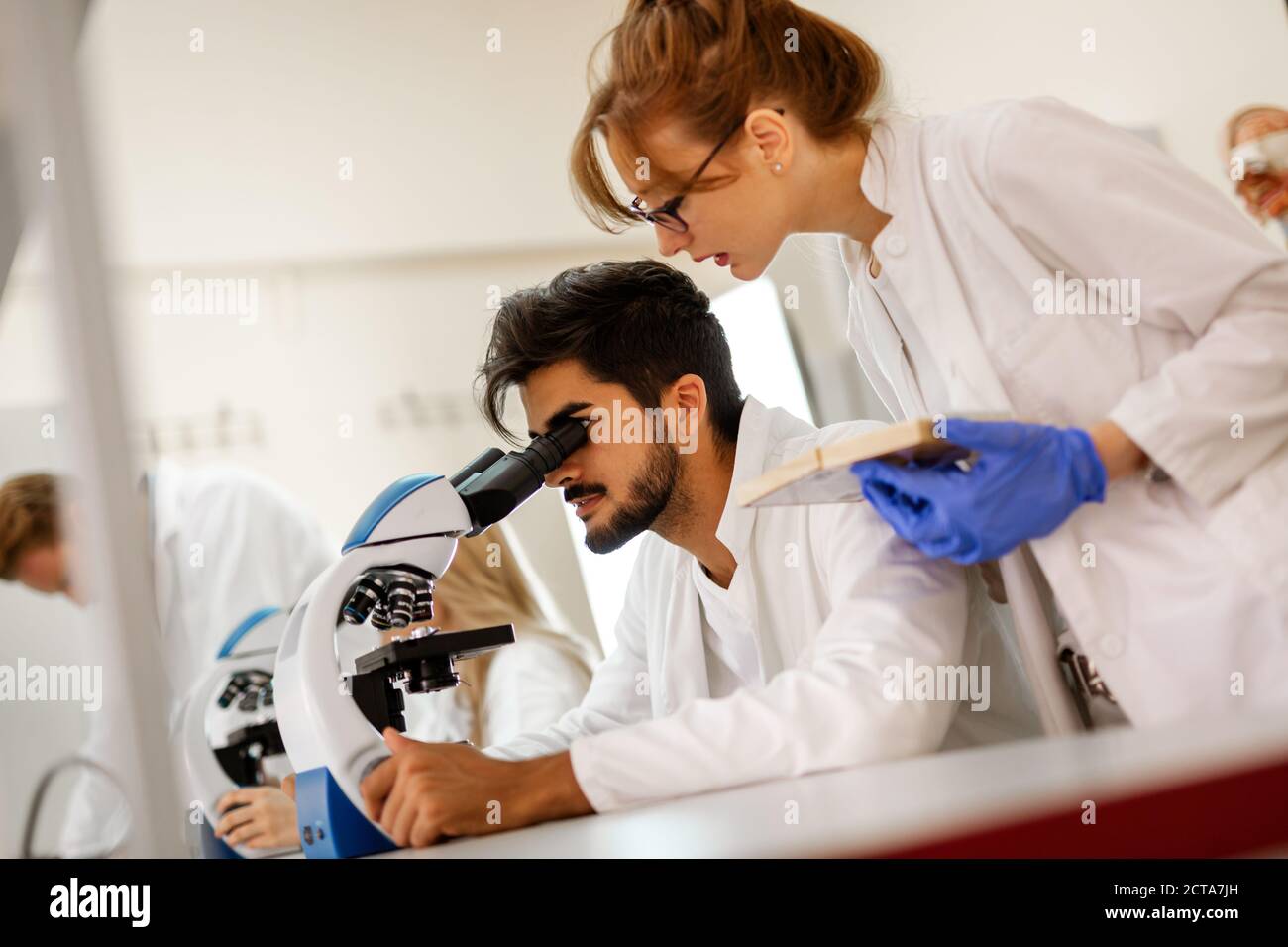 Young scientists, students of chemistry working in laboratory Stock ...