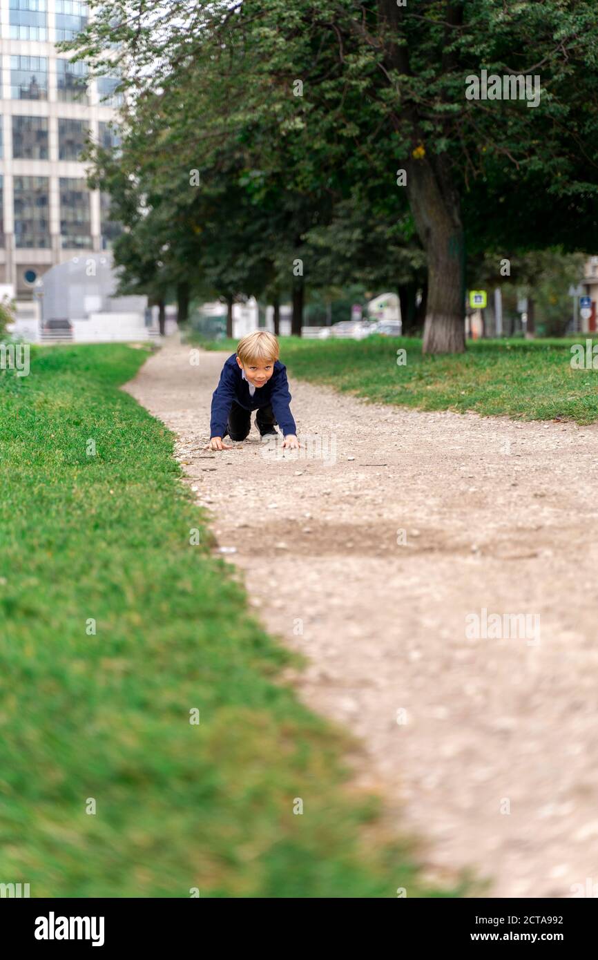 little boy getting ready to start. the concept of the beginning of the ...