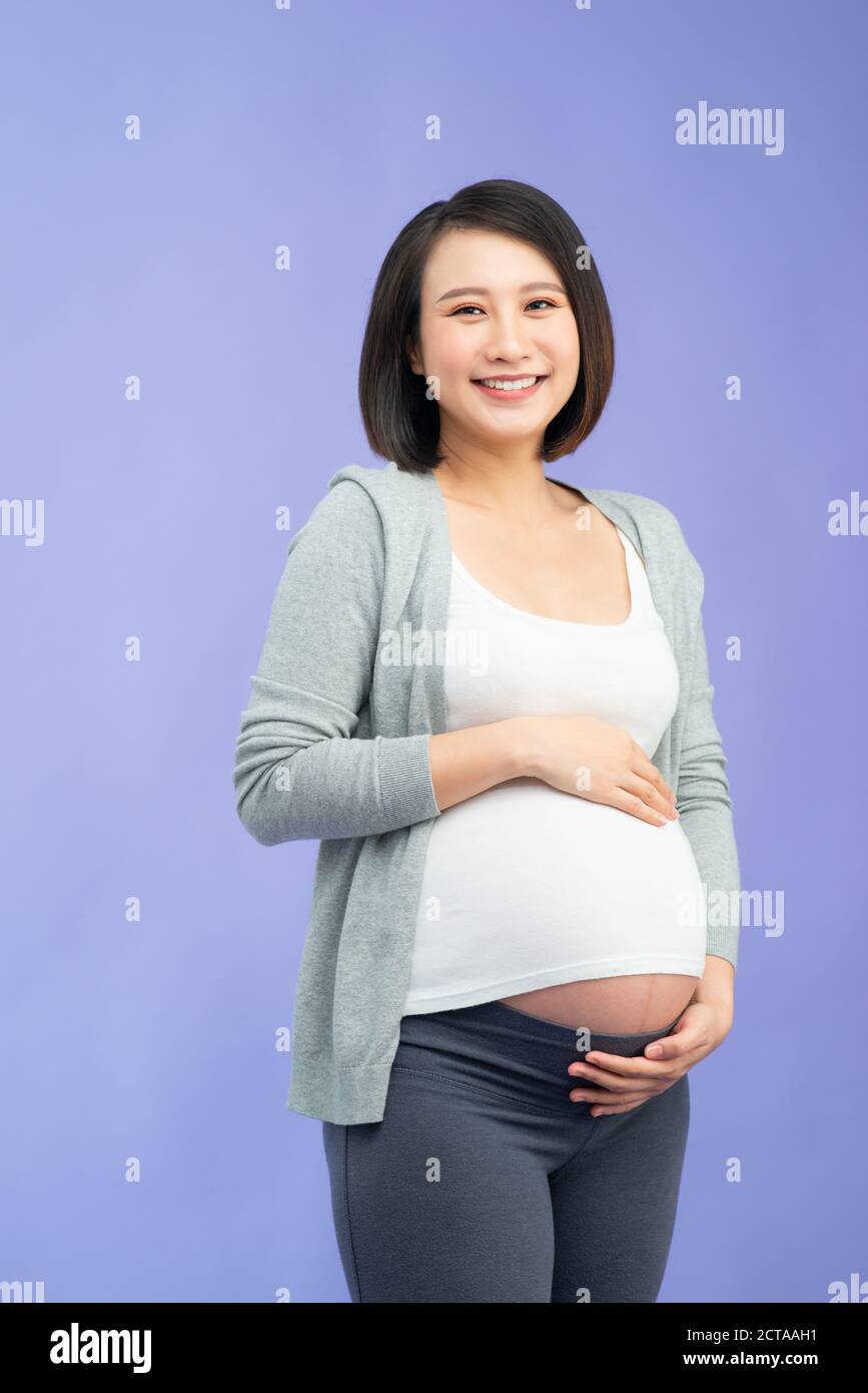 young pretty asian woman pregnant happy smiling Stock Photo - Alamy