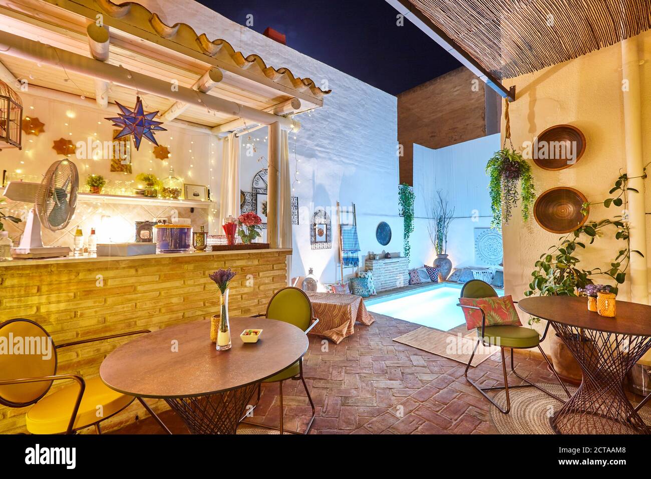 Traditional andalusian style patio with pool by night. Tourism Spain ...